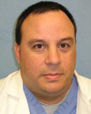 Greg J. Den Haese, MD